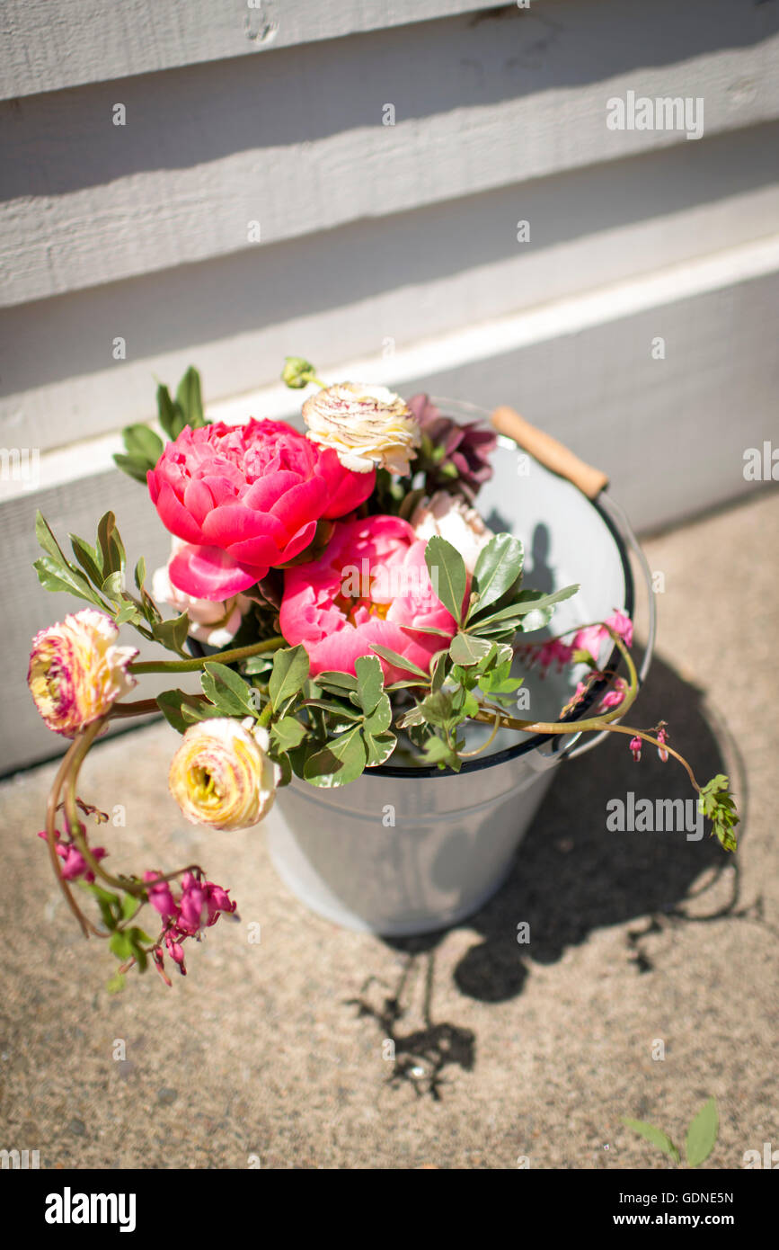 Bucket of flowers Stock Photo - Alamy