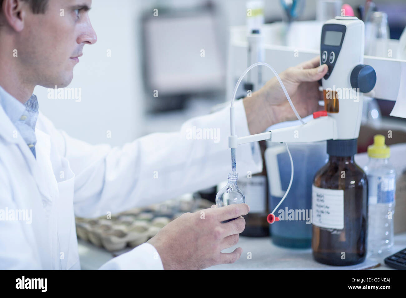 Man looking at monitor in laboratory Stock Photo - Alamy
