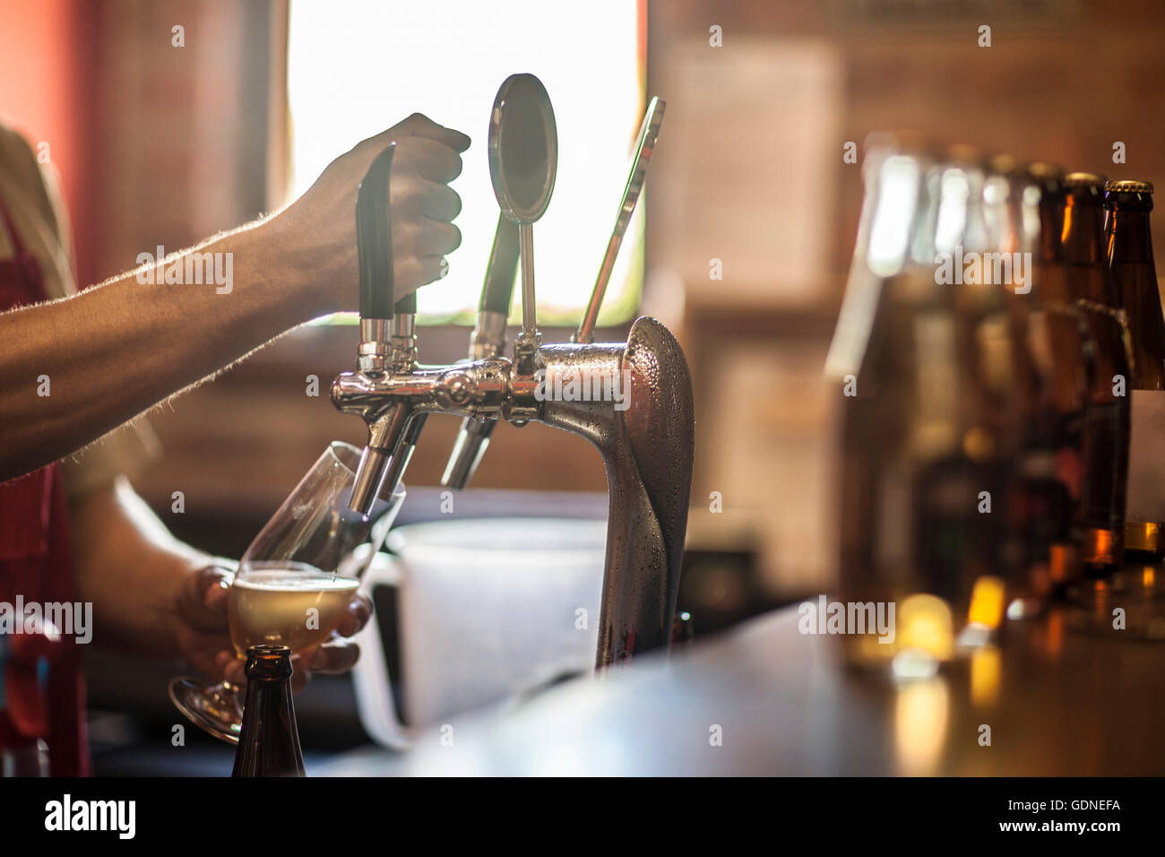 Bartender filling glass beer hi-res stock photography and images - Alamy