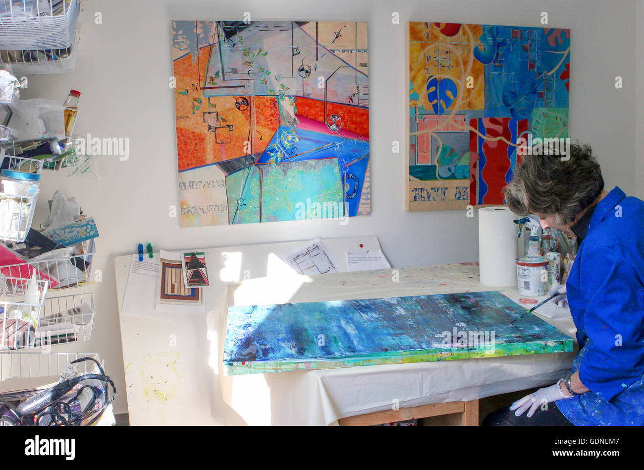 Artist painting canvas Stock Photo - Alamy