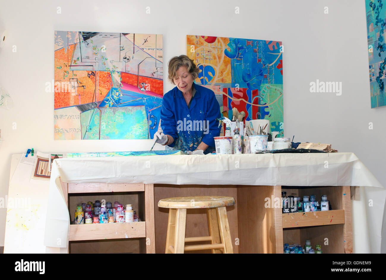 Older woman painting wall hi-res stock photography and images - Alamy