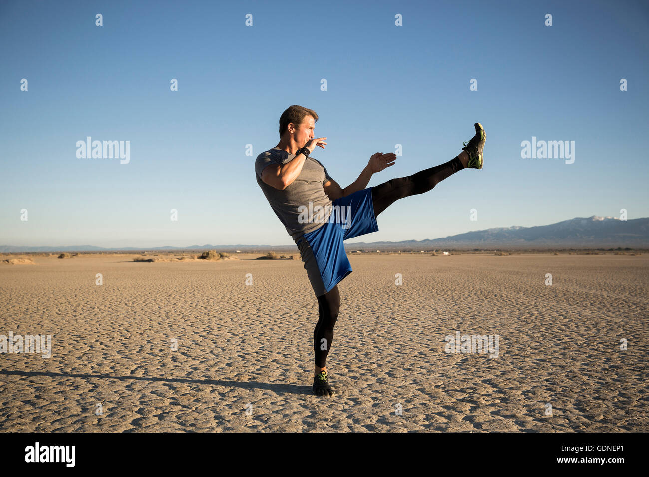 Man kicking man hi-res stock photography and images - Alamy