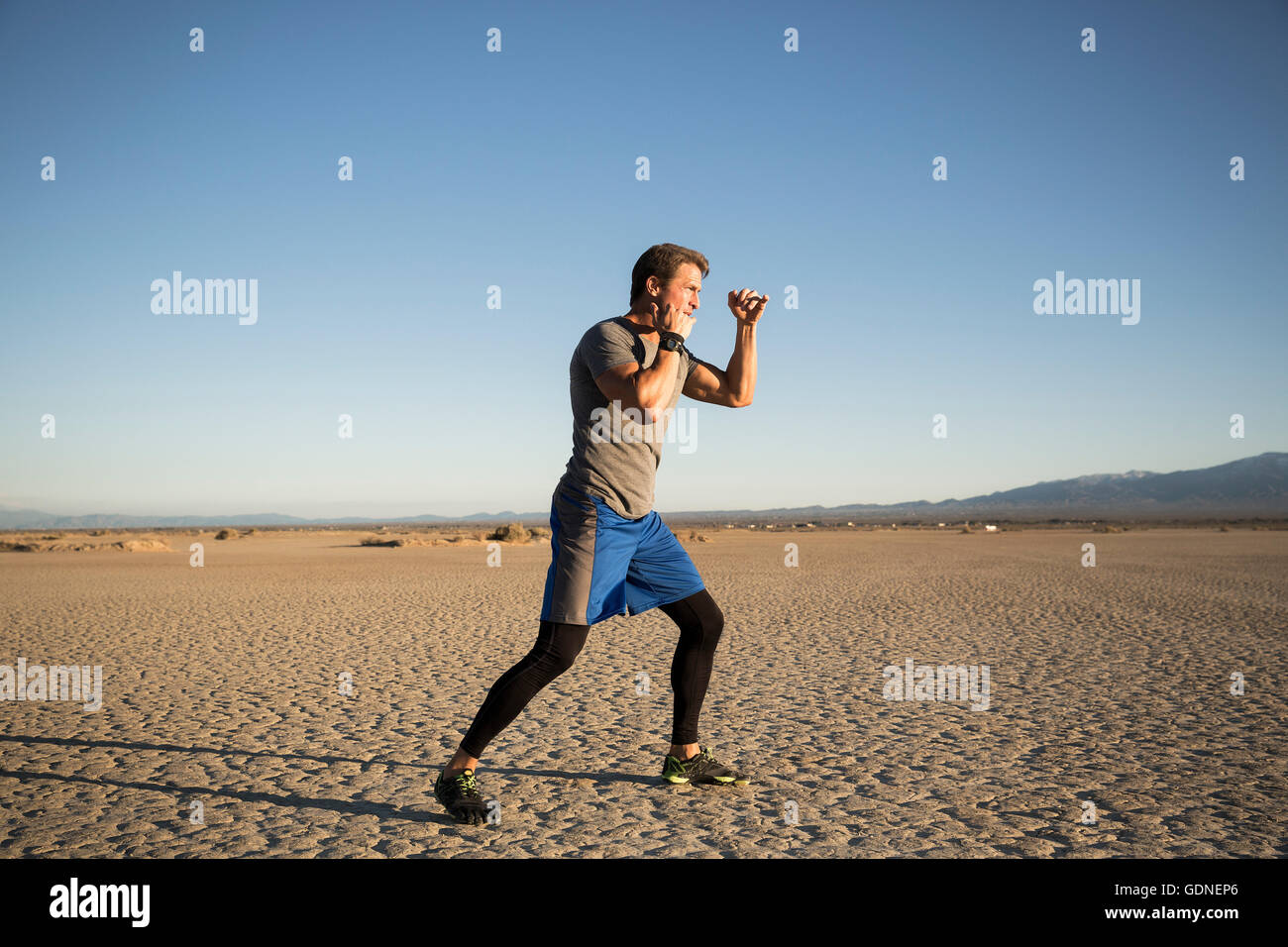 Man kickbox training on dry lake bed, El Mirage, California, USA Stock ...