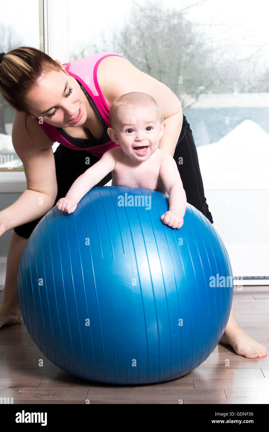 Mother with child boy doing fitness exercises Stock Photo - Alamy