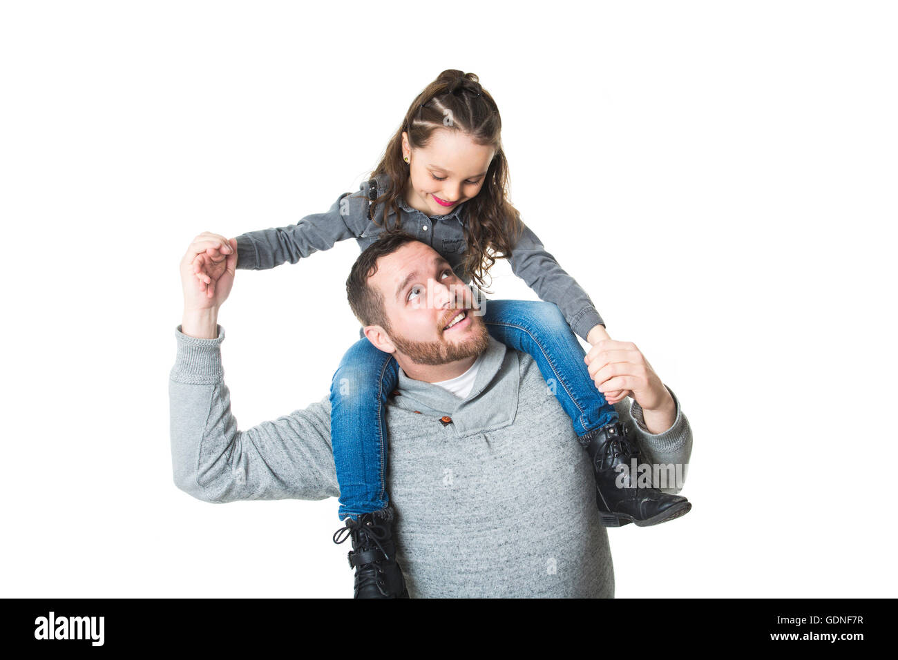 Father carrying daughter on his shoulders, studio shot Stock Photo - Alamy