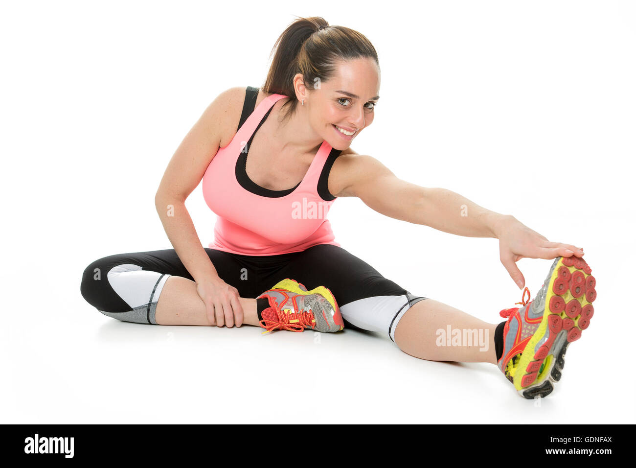 Fitness woman stretching full body over white background Stock Photo ...