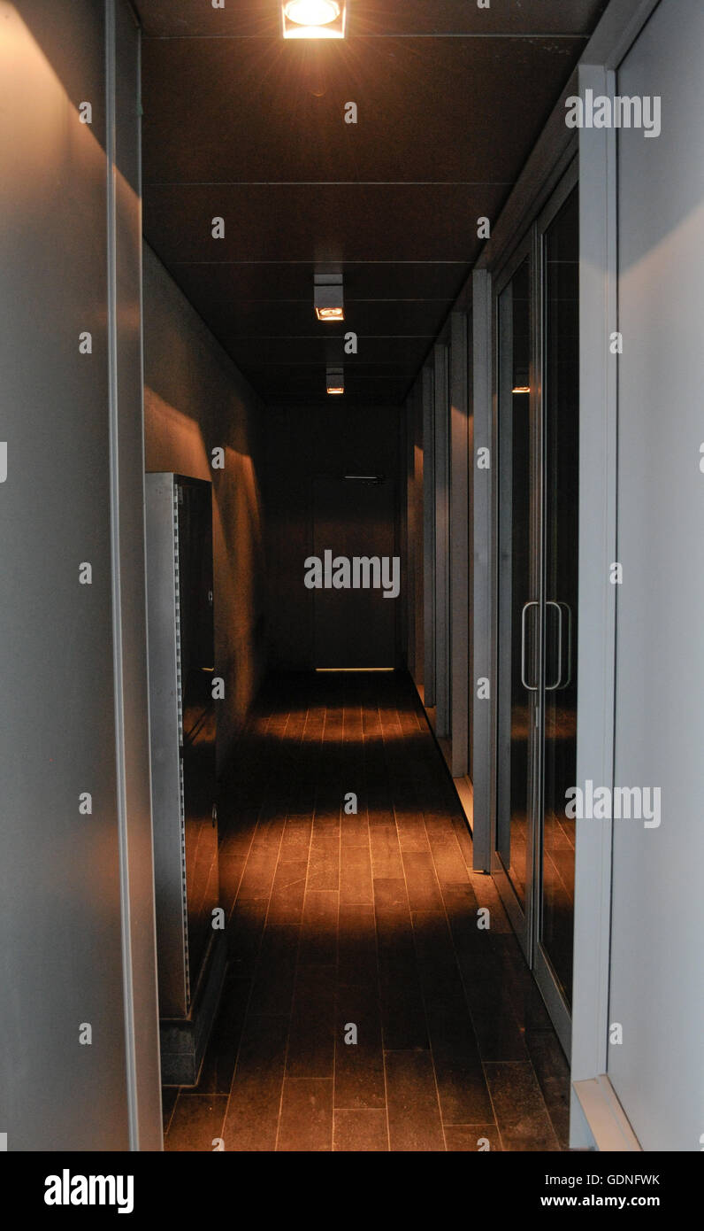 Narrow corridor inside an office building Stock Photo - Alamy