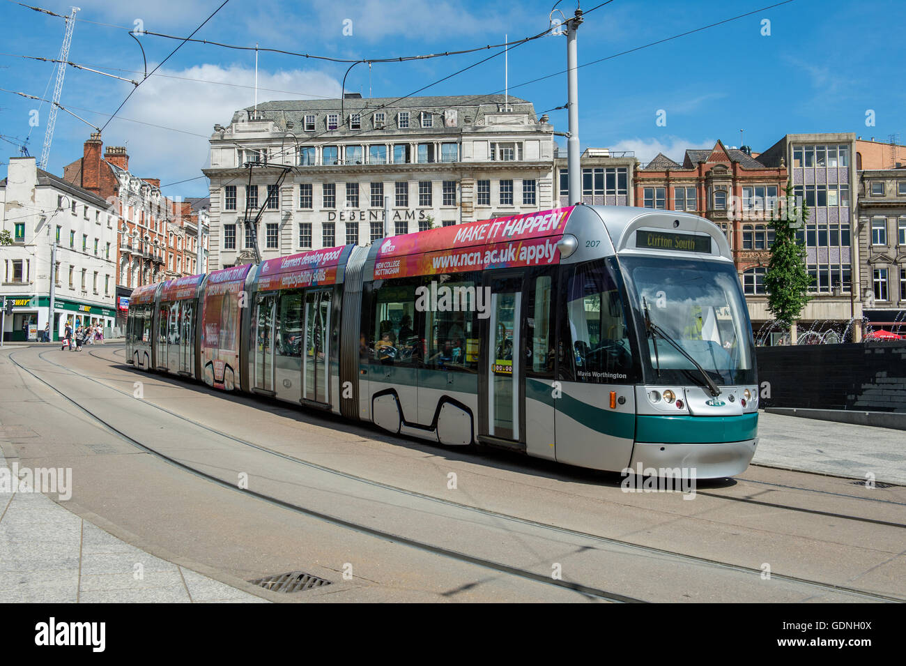 New Nottingham Express Transit Tram NET driving through Nottingham City ...