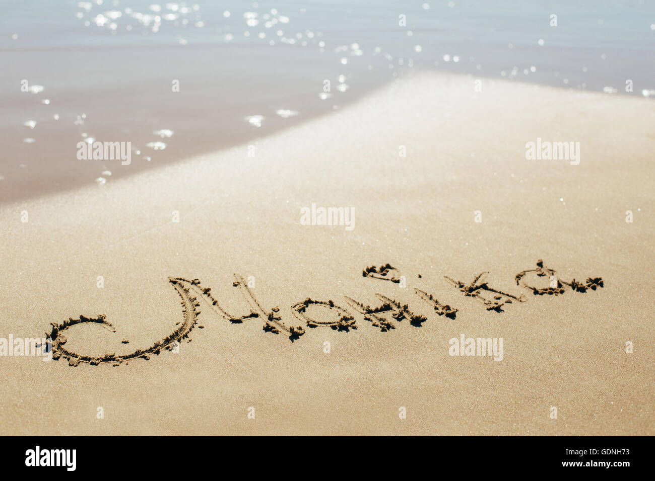 The name is written on the wet sand of the sea Stock Photo - Alamy