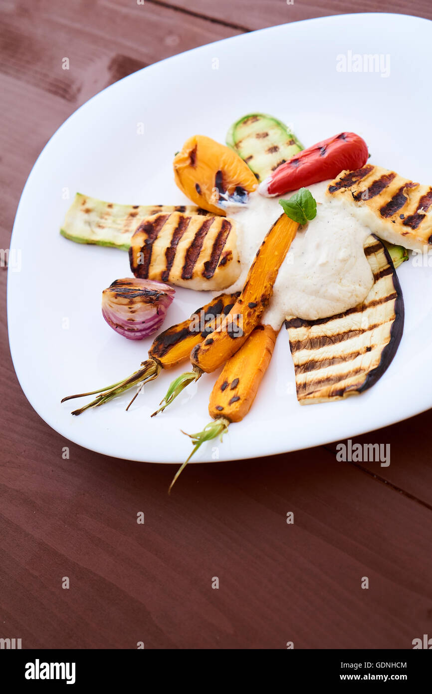 Food presentation, mixed roasted vegetables with grilled cheese and ...