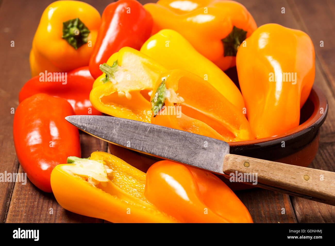 Small bell peppers in red and orange Stock Photo - Alamy