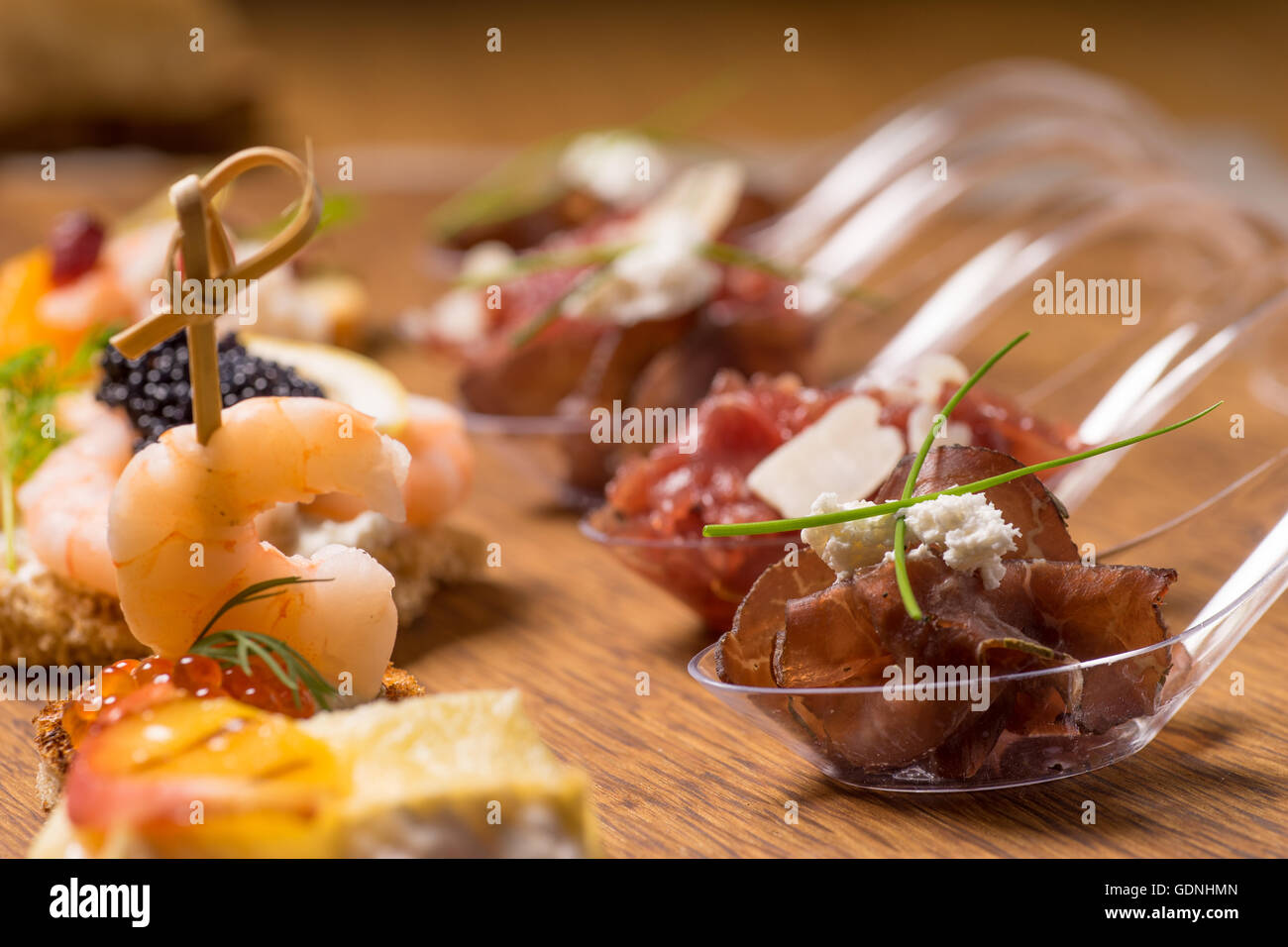 Exquisite selection of luxury canapes, appetizer ready to be served for ...