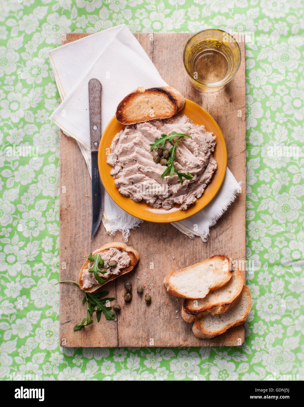 Fish pate spread with toast on a wood board Stock Photo - Alamy