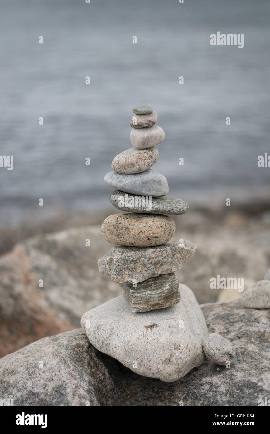 rock cairn built on the Rhode Island shoreline Stock Photo - Alamy