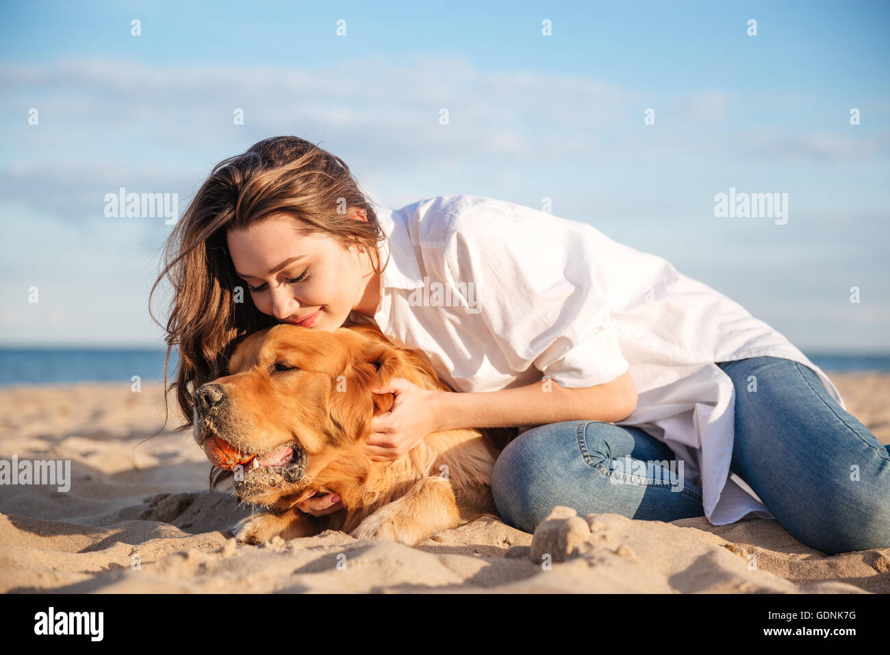 Woman hugging beach ball hi-res stock photography and images - Alamy