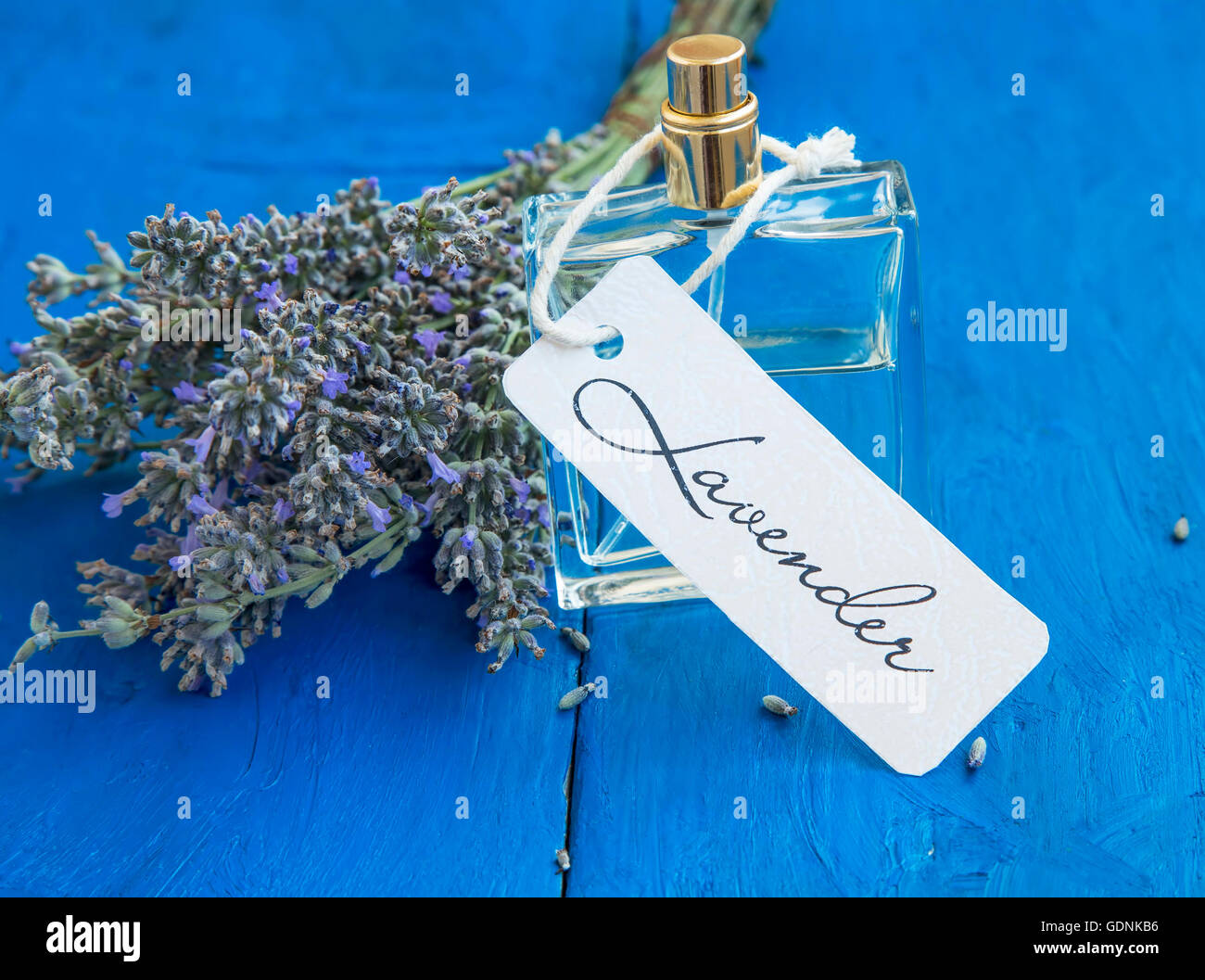 Lavender perfume bottle with label and lavender flowers bunch Stock ...