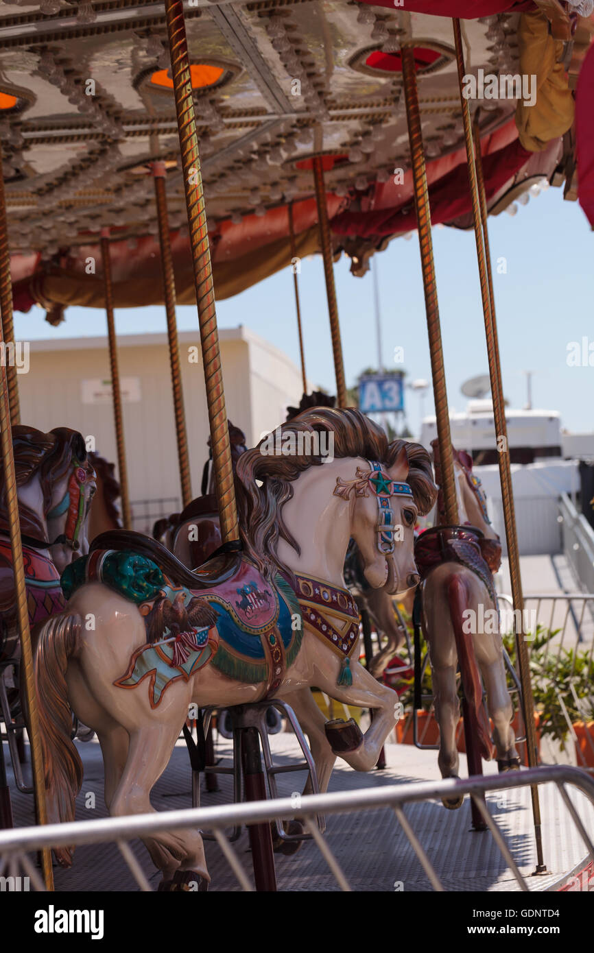 Colorful animal carousel carnival ride on a fairground in summer Stock ...