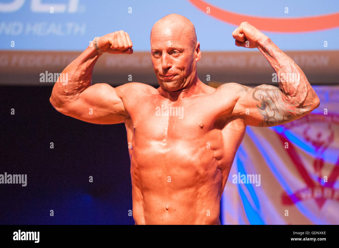 Male bodybuilder Erik Stobbe shows his best front double biceps pose ...