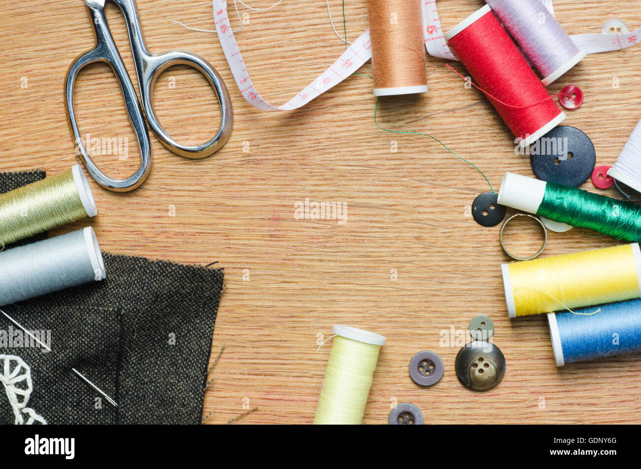 sewing set on wooden background Stock Photo - Alamy