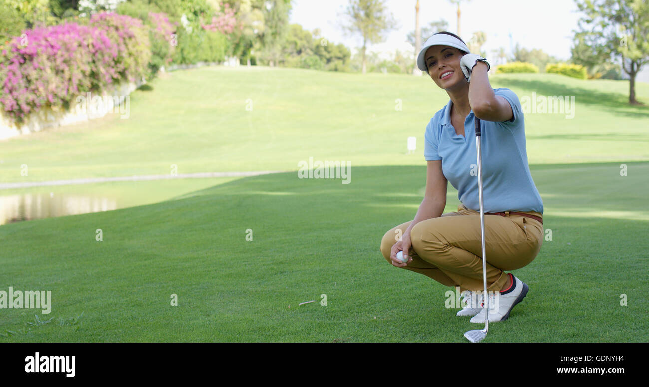 Smiling female golf player hi-res stock photography and images - Alamy