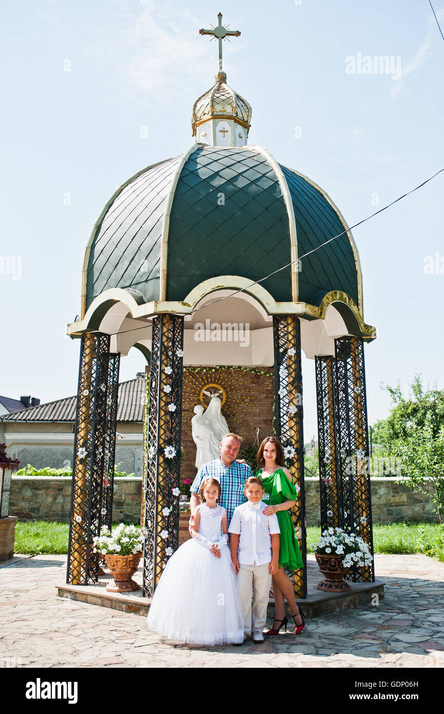 Happy family at first holy communion stay background church oratory ...