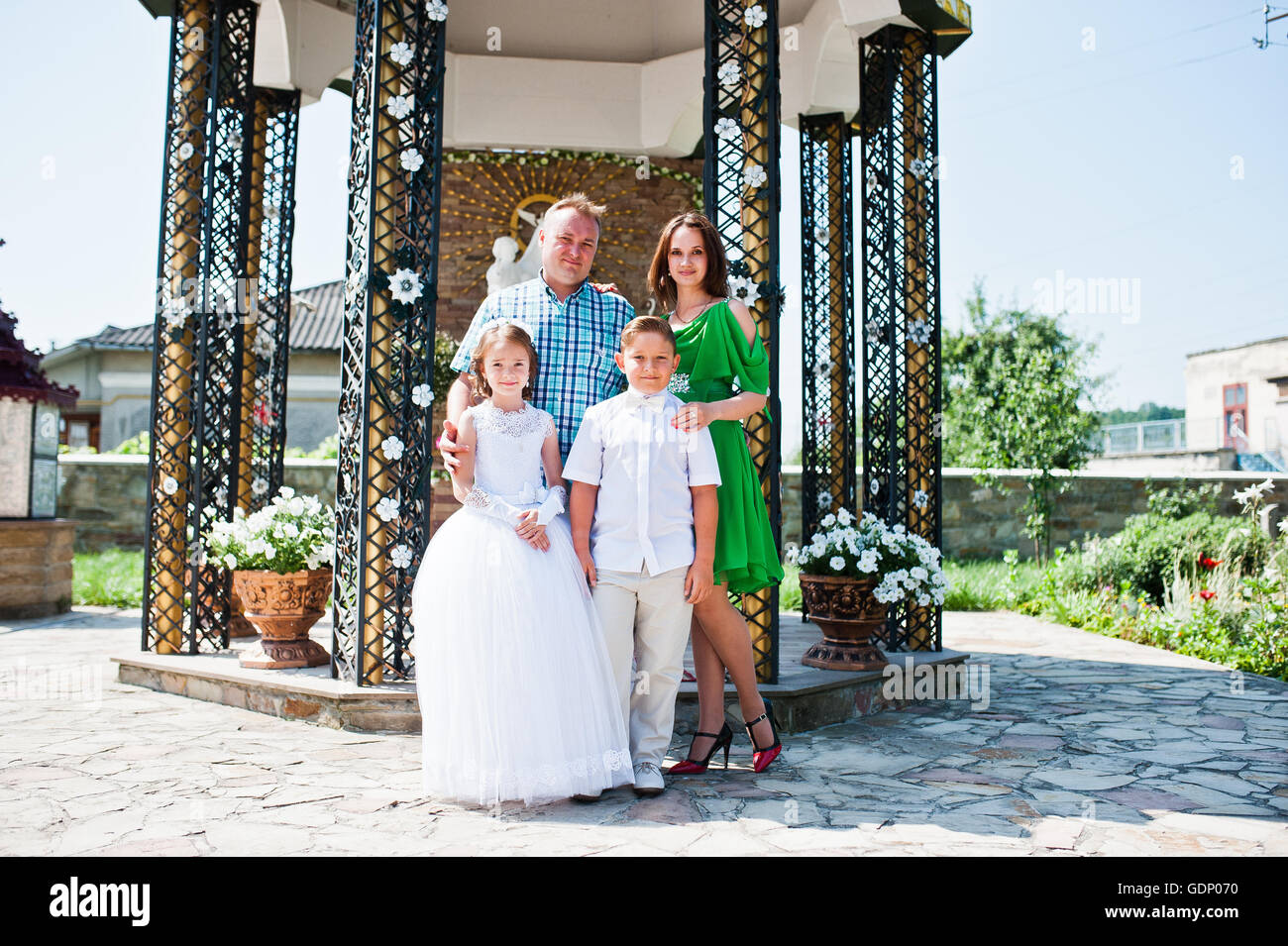 Happy family at first holy communion stay background church oratory ...