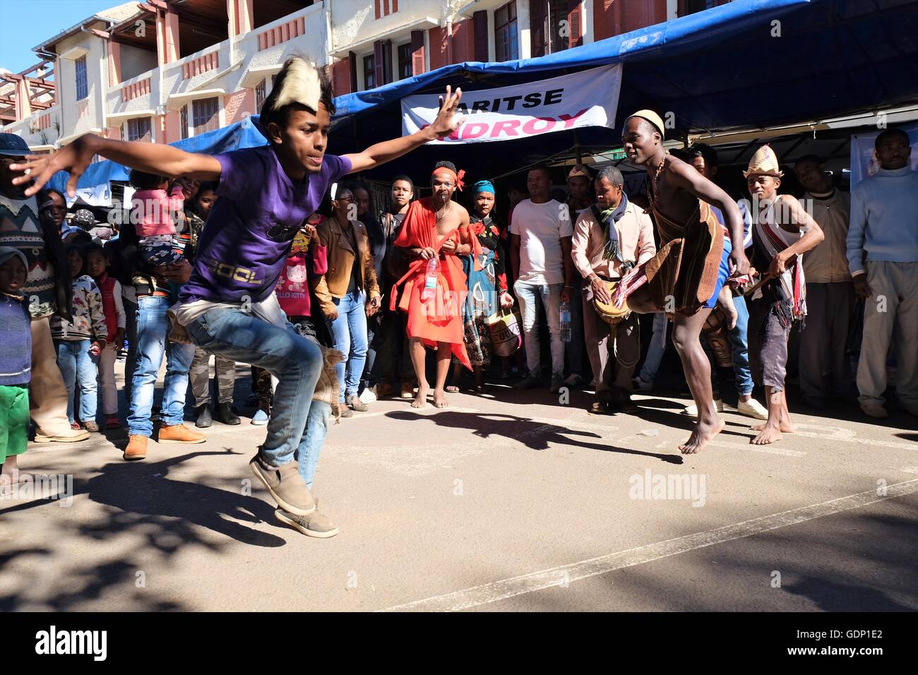 Antananarivo, Madagascar—19 June 2016. Malagasy men dancing to the beat ...