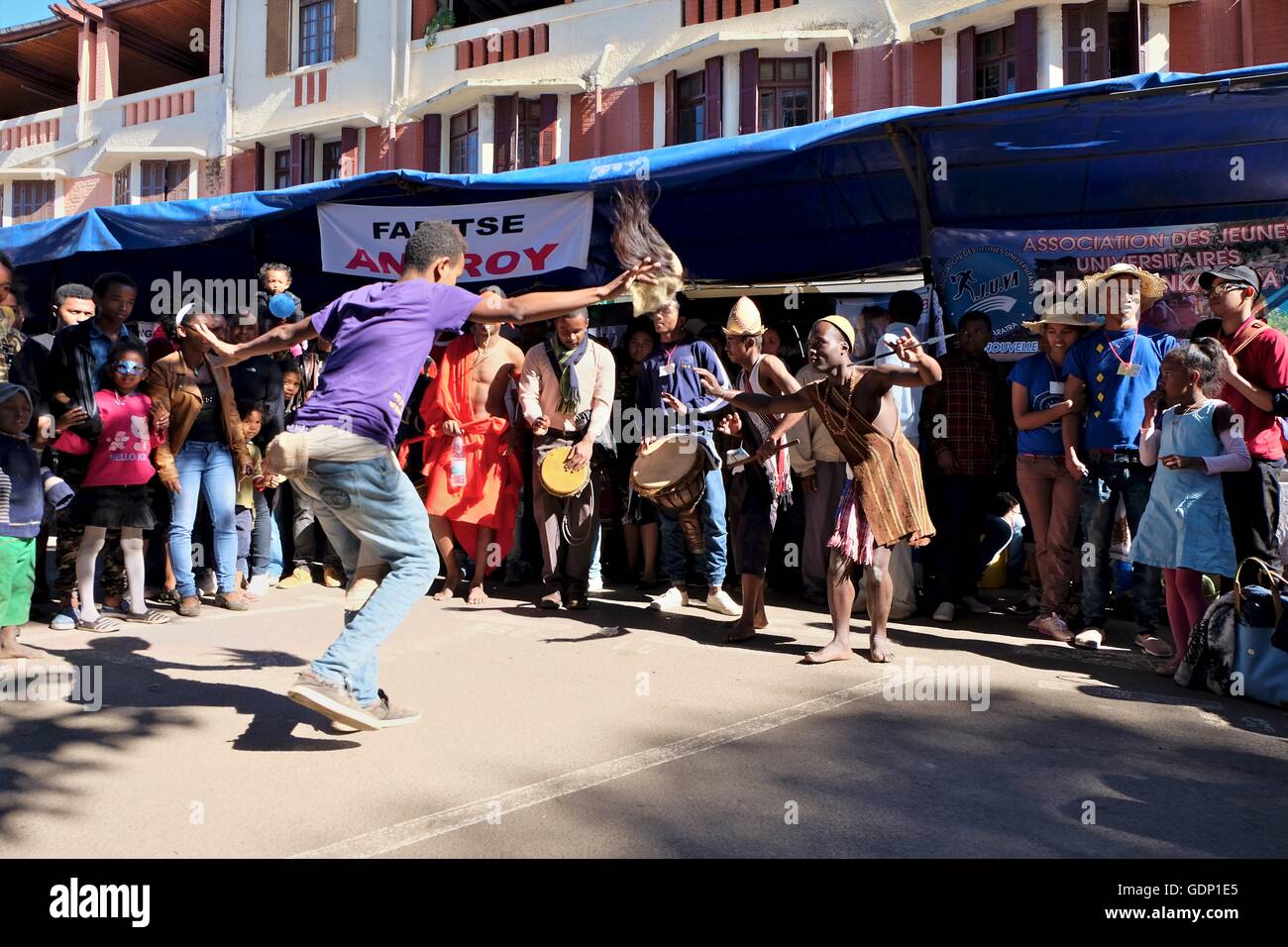 Antananarivo, Madagascar—19 June 2016. Malagasy men dancing to the beat ...