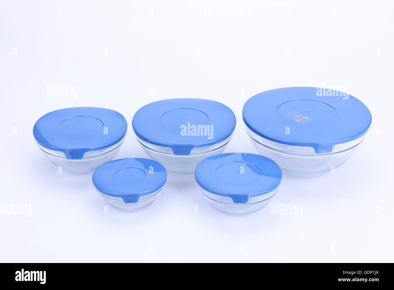 glass food container with blue plastic lid isolated on white background ...