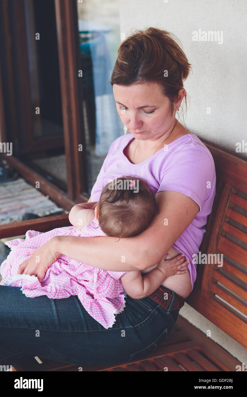 Woman breastfeeding child care hi-res stock photography and images - Alamy