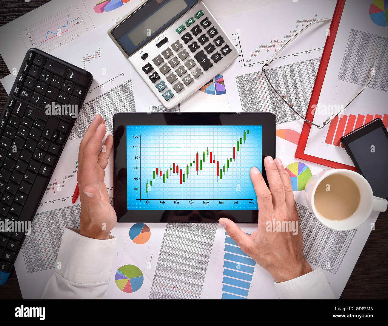 hands using digital tablet with chart on screen Stock Photo - Alamy