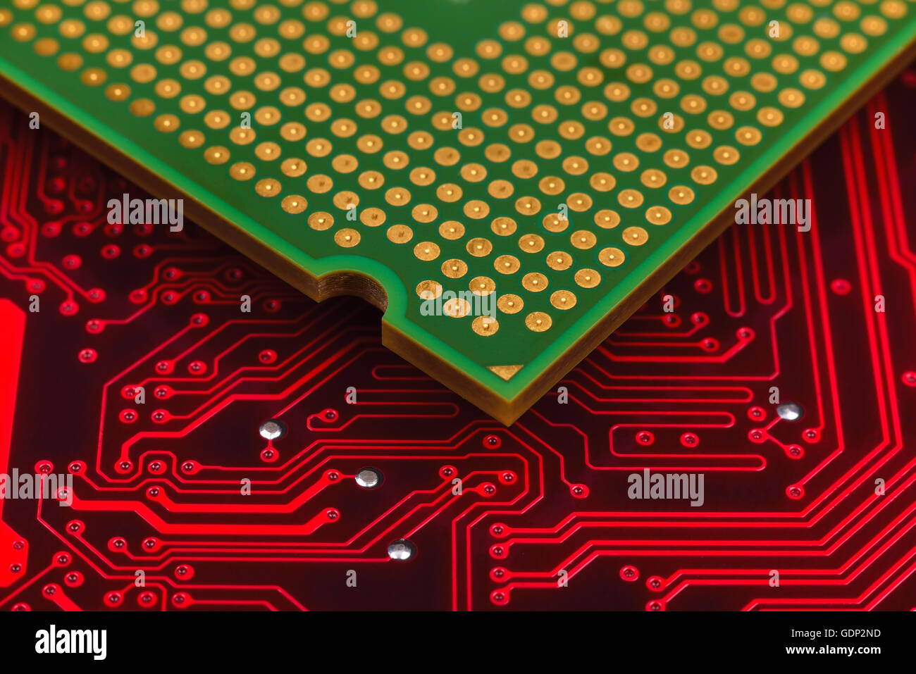 Central Processing Unit on red motherboard, close up Stock Photo - Alamy