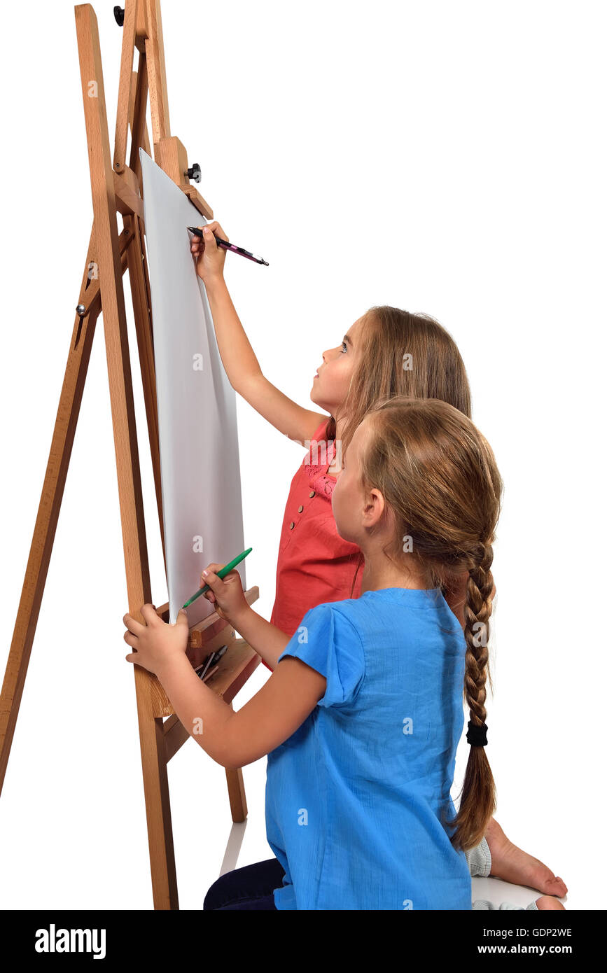 two little girl is painting on blank easel Stock Photo - Alamy