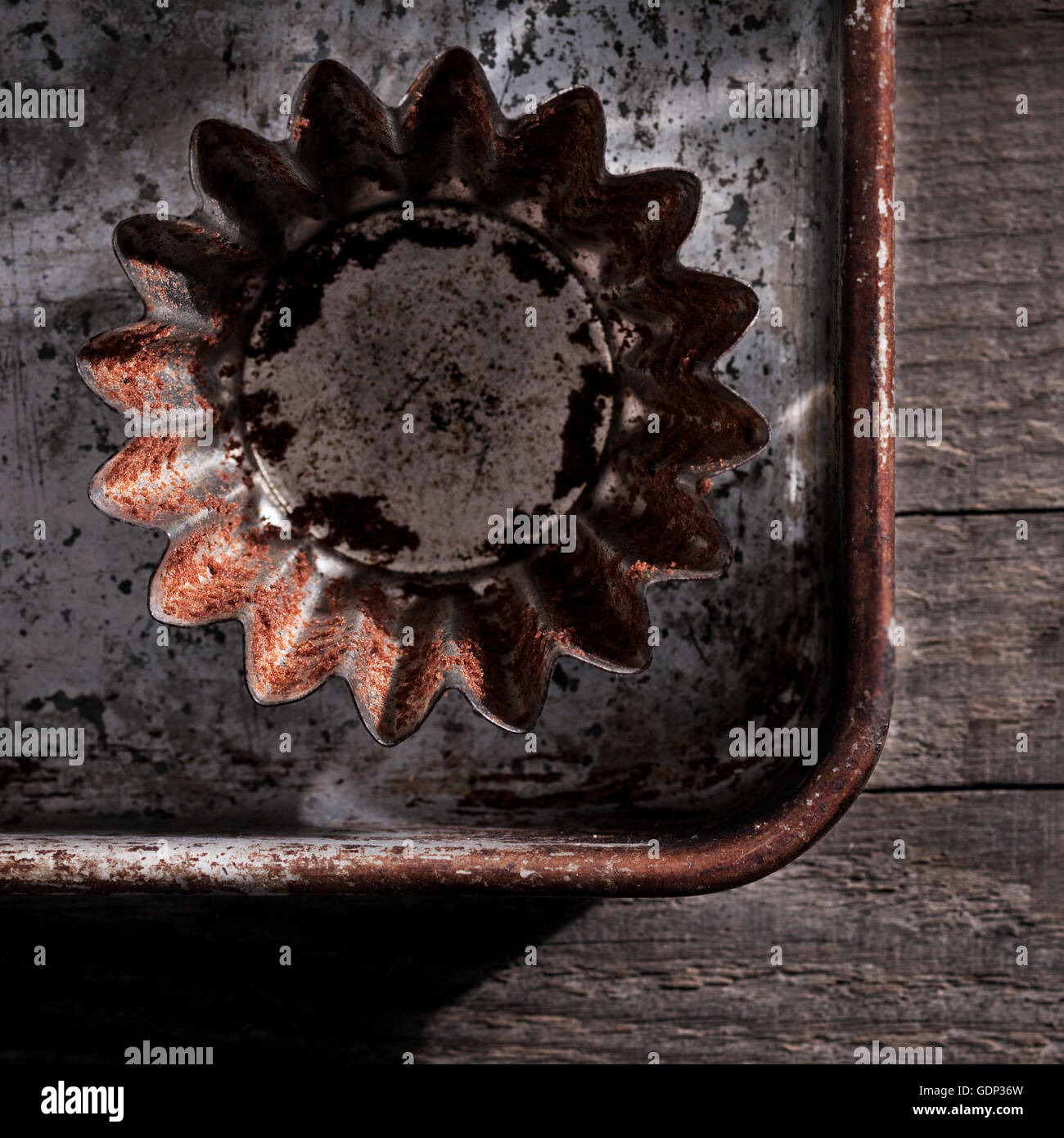 Old rustic muffin tin Stock Photo - Alamy