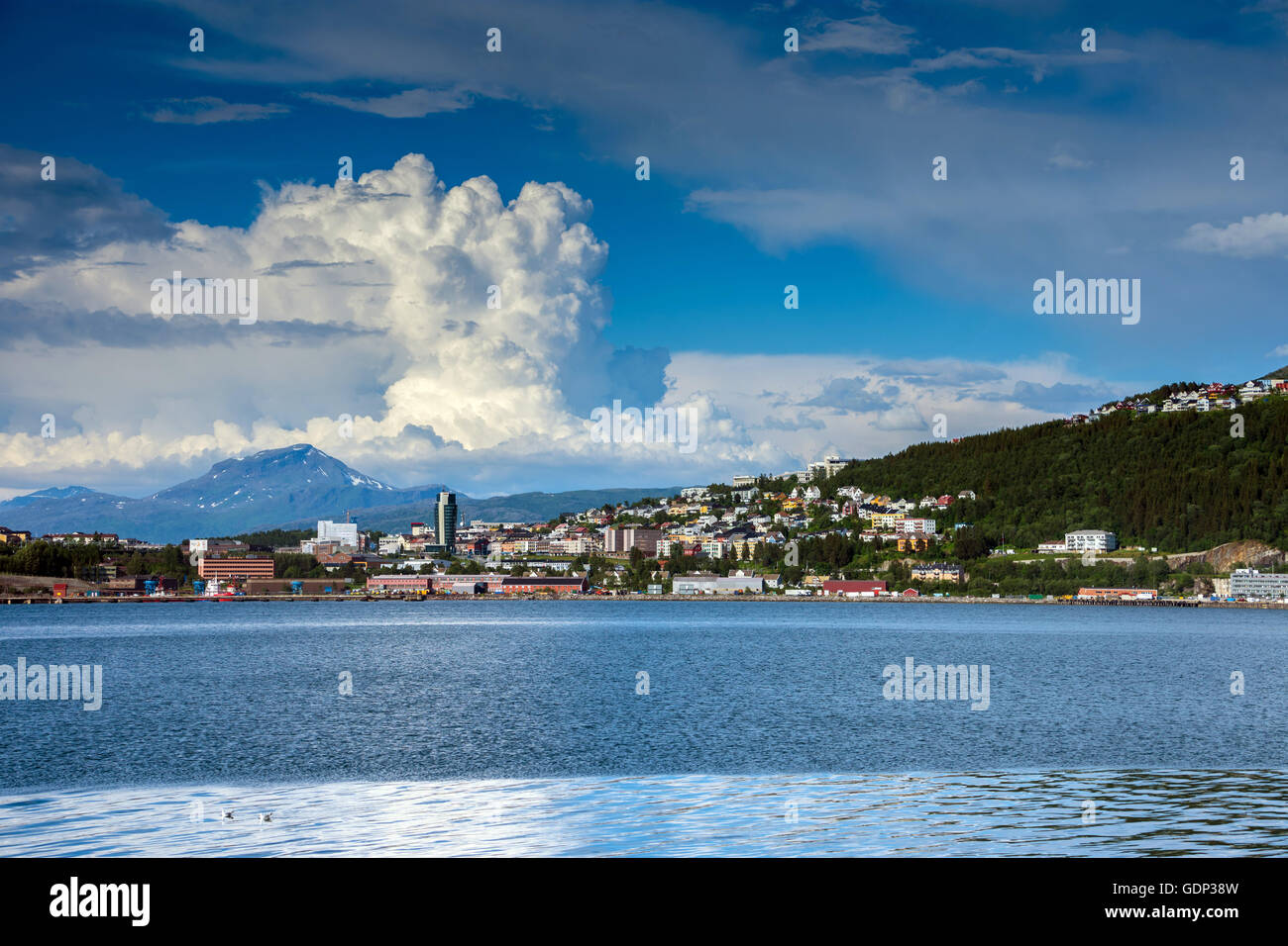 Narvik city seen across Ofotfjorden with cumulonimbus thunder clouds ...
