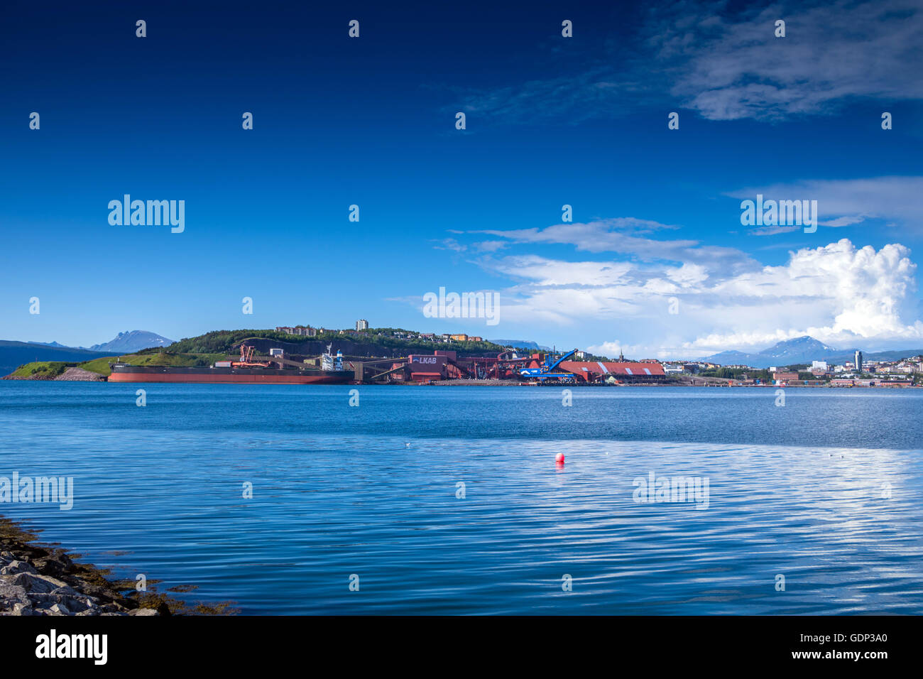 Narvik city seen across ofotfjorden with cumulonimbus thunder clouds hi ...