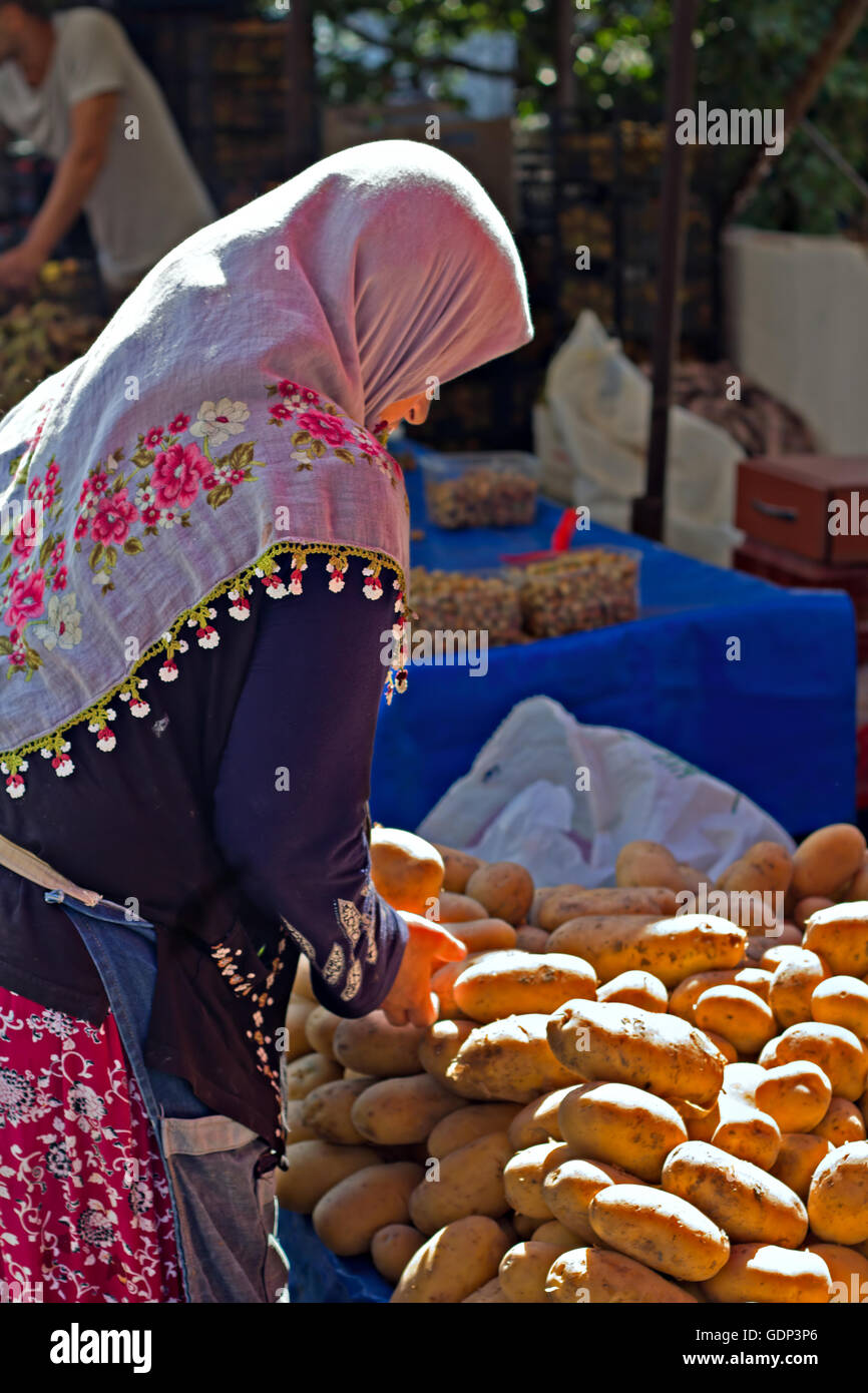 Turkish woman preparing her stall at an outdoor street market Stock ...