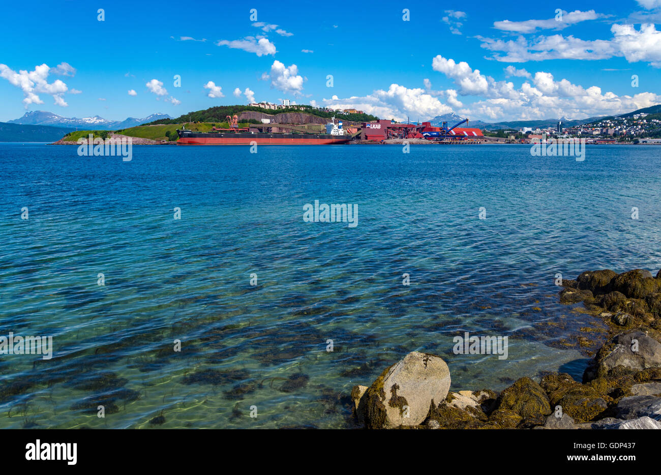 Shallow blue sea with Alexandra P bulk ore carrier, moored at LKAB ...