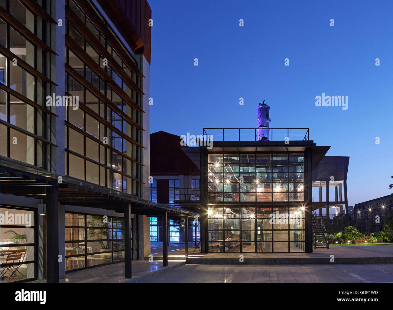 Dusk view looking into converted industrial building. Imagine Studio at ...