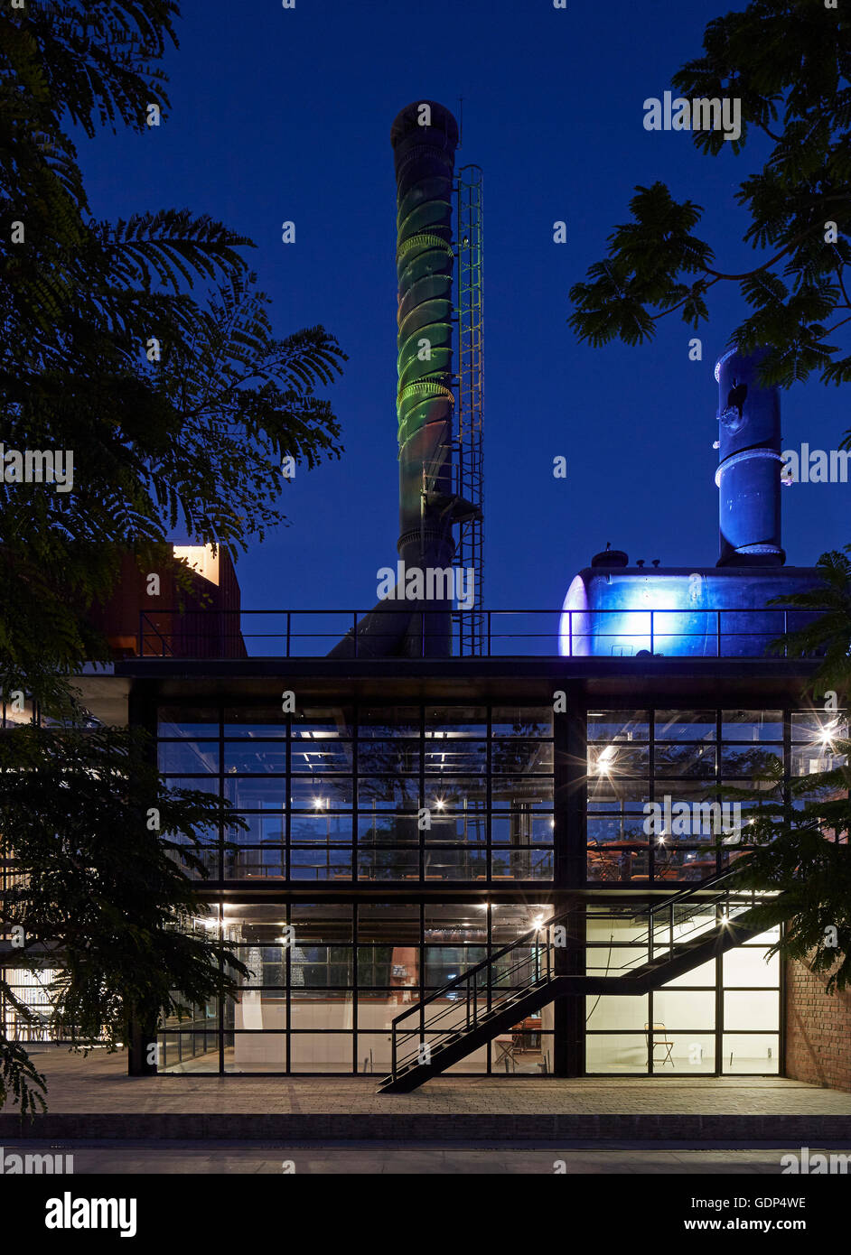 Dusk view looking into converted industrial building. Imagine Studio at ...