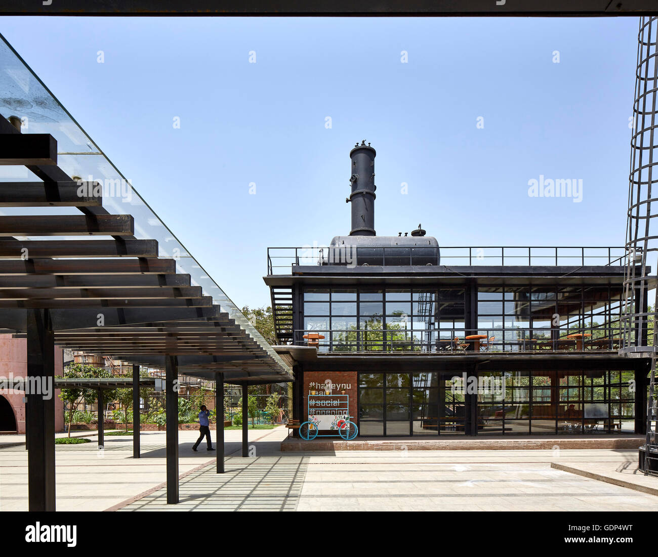 View towards cafe with covered walkway addition. Imagine Studio at The ...