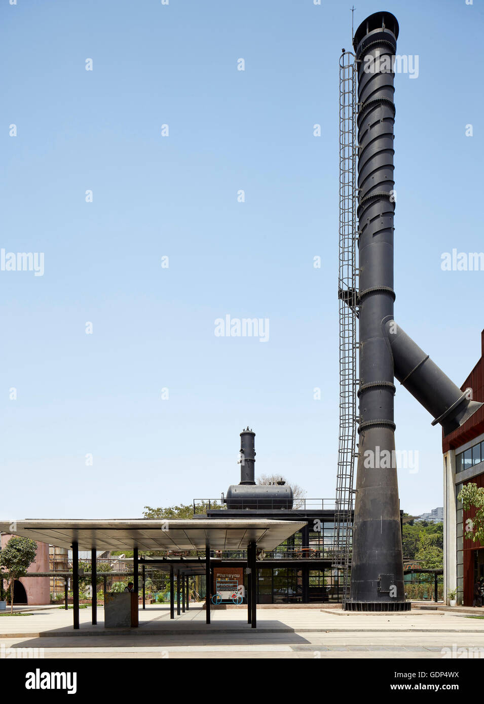 View towards cafe with covered walkway addition. Imagine Studio at The ...