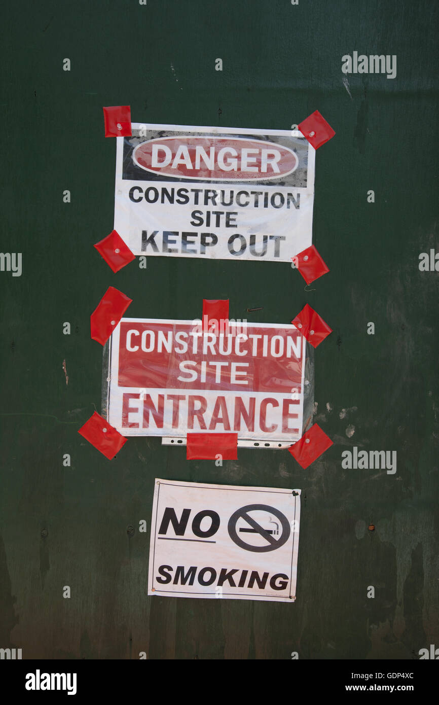 Signs posted along building construction site in downtown Brooklyn, NY ...