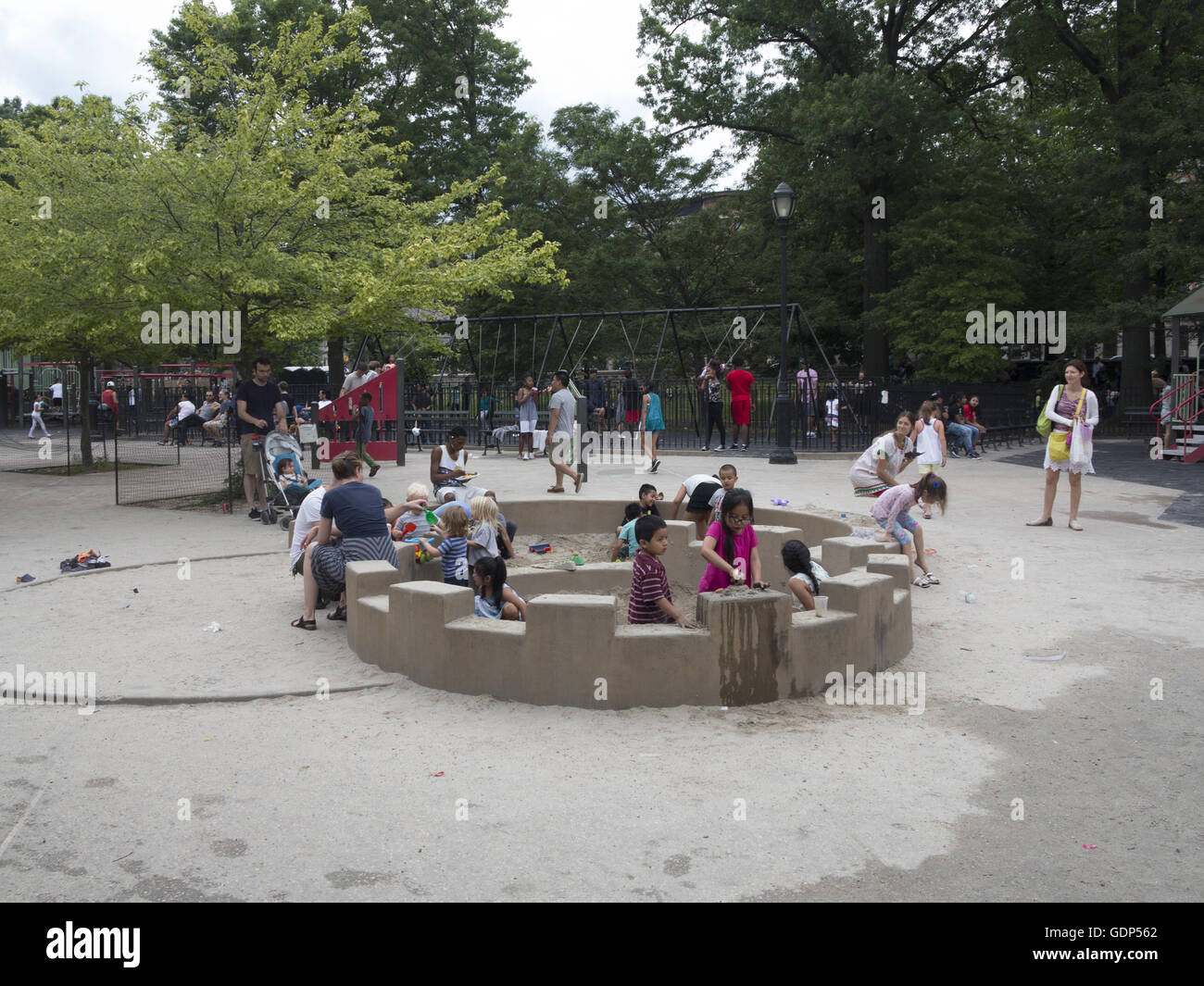 Kids play in the sandbox at the 11th Street Playground in Prospect Park ...