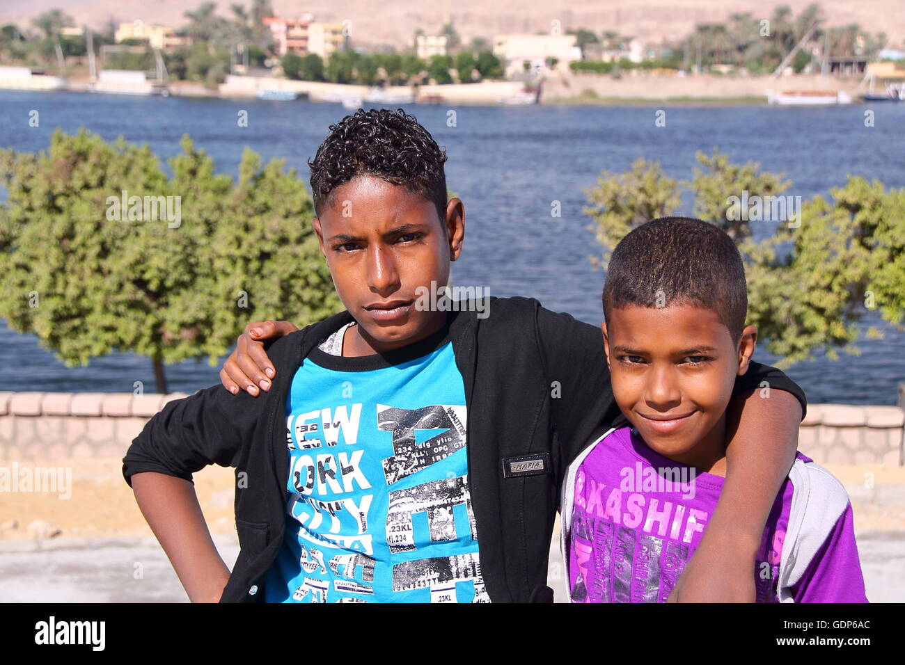 Two young Egyptian boys posing on the East bank of the Nile, Luxor ...