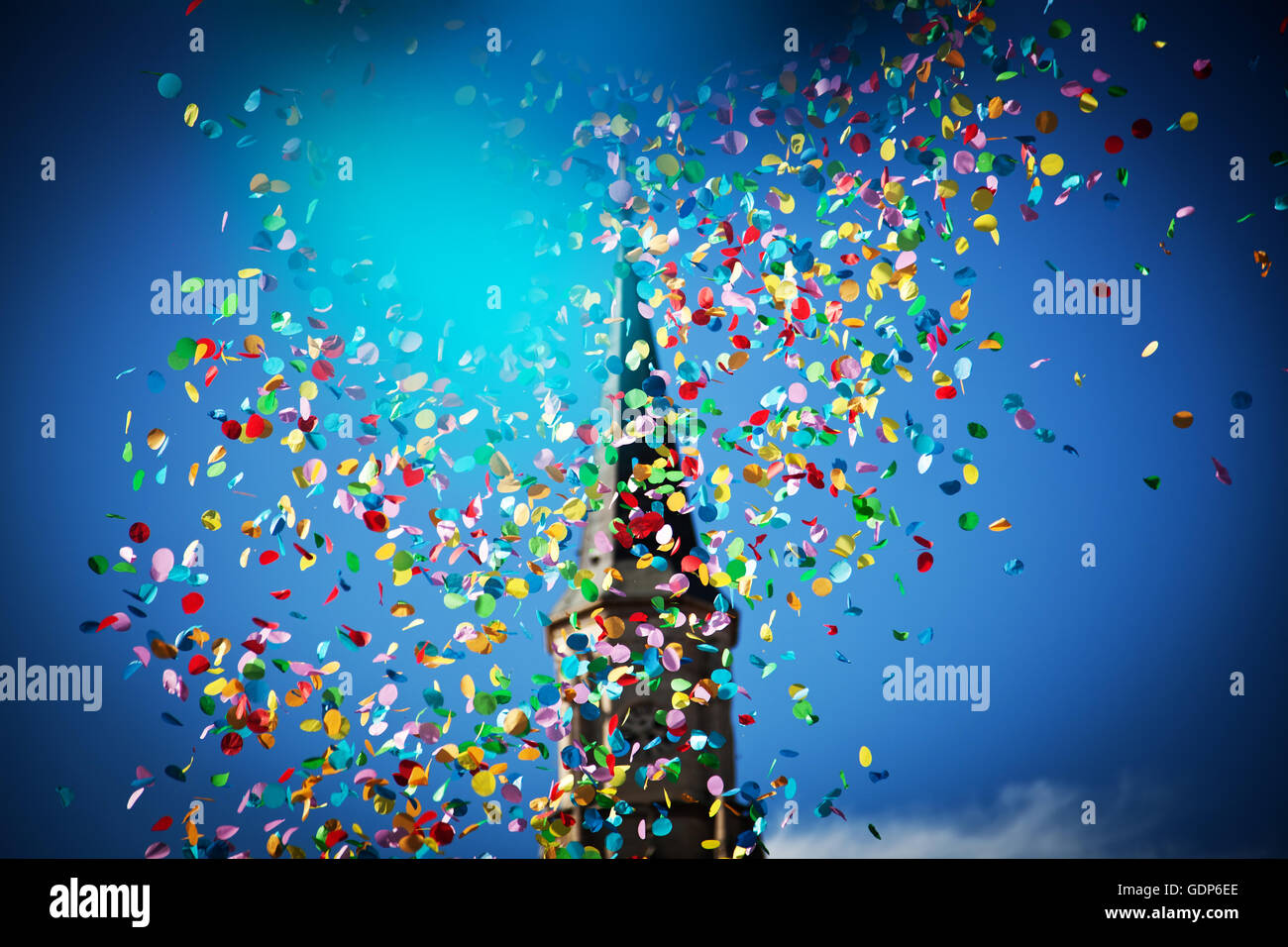 falling confetti in the city festival on blue sky background Stock ...