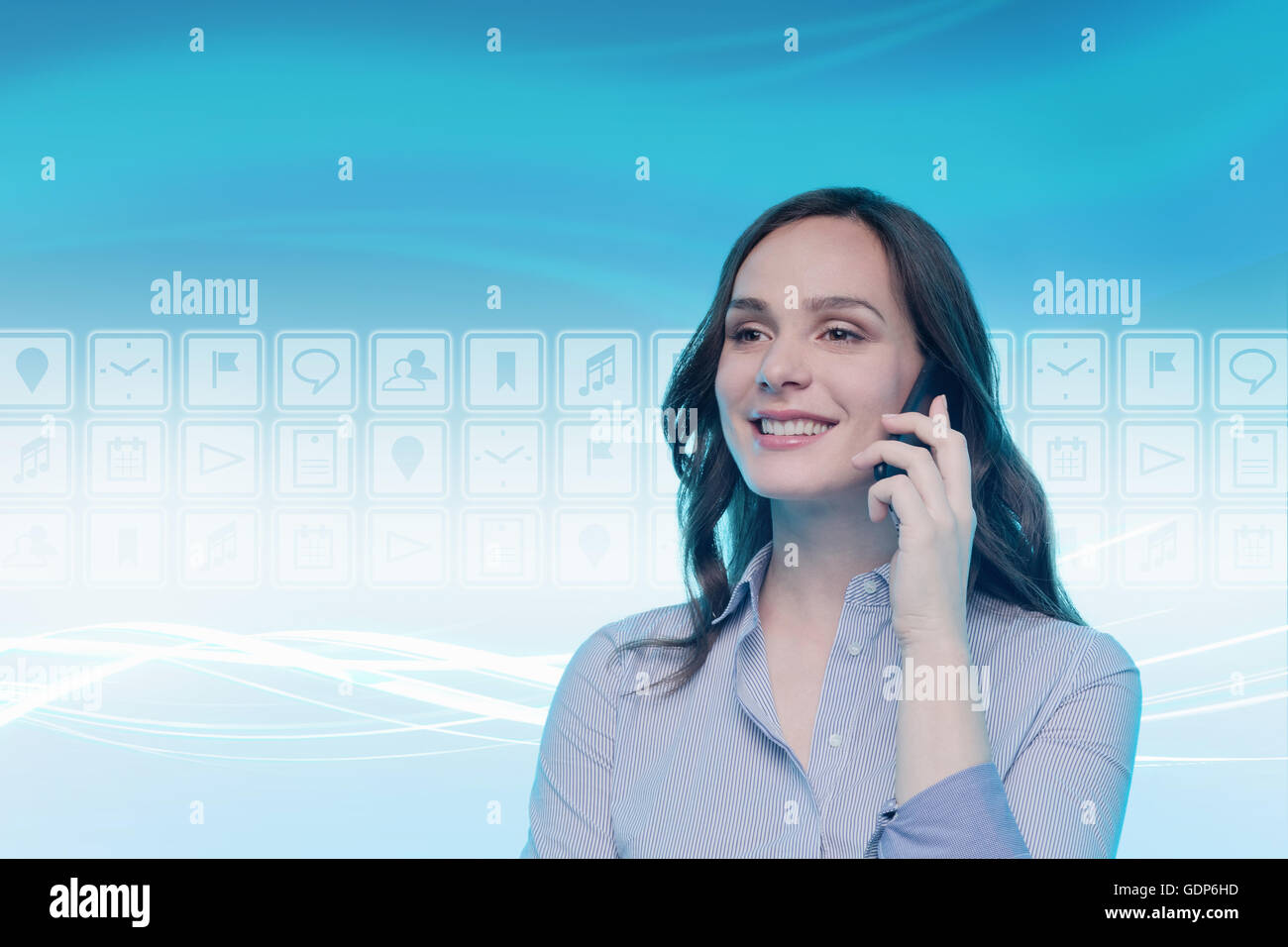 Young woman using mobile phone, digital icons behind her Stock Photo ...