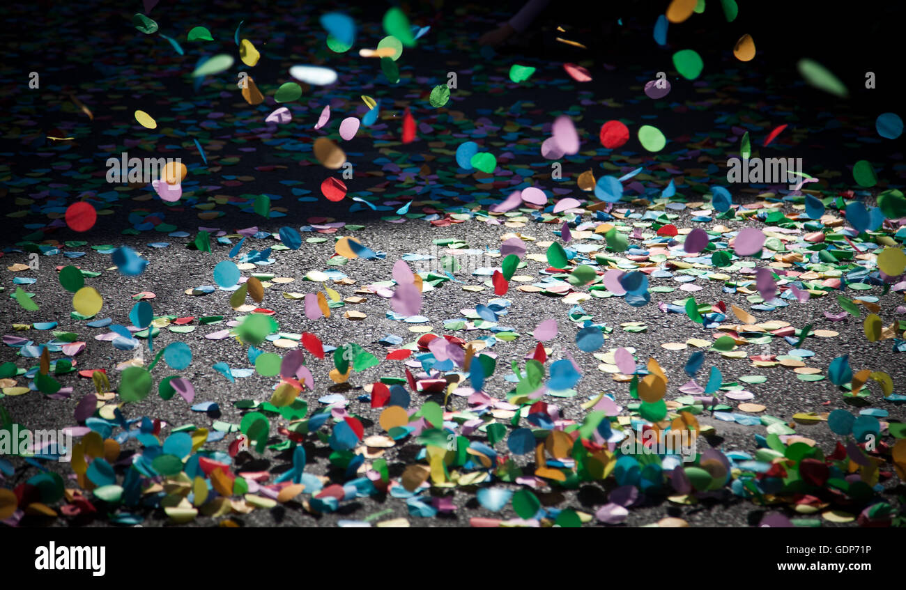 falling confetti in the city festival on blue sky background Stock ...