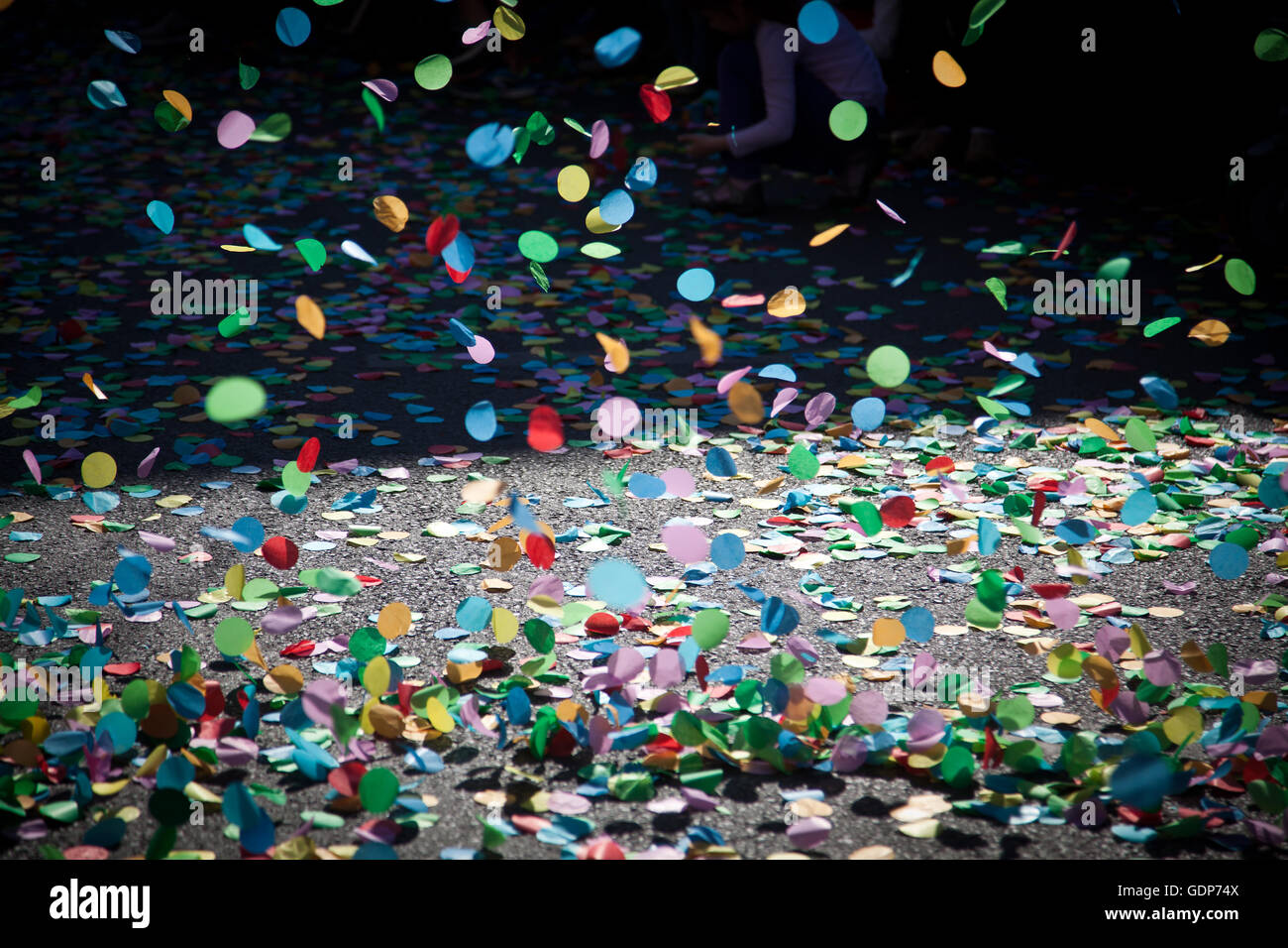 falling confetti in the city festival on blue sky background Stock ...