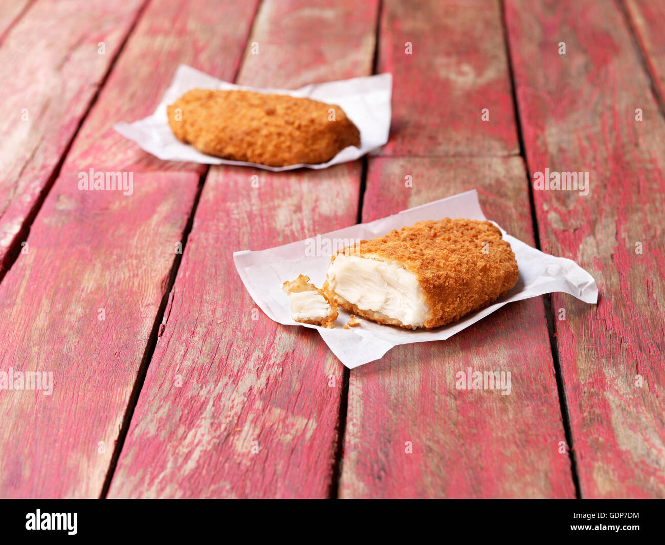 Food, fish, gluten free breaded cod on painted red wooden table Stock ...